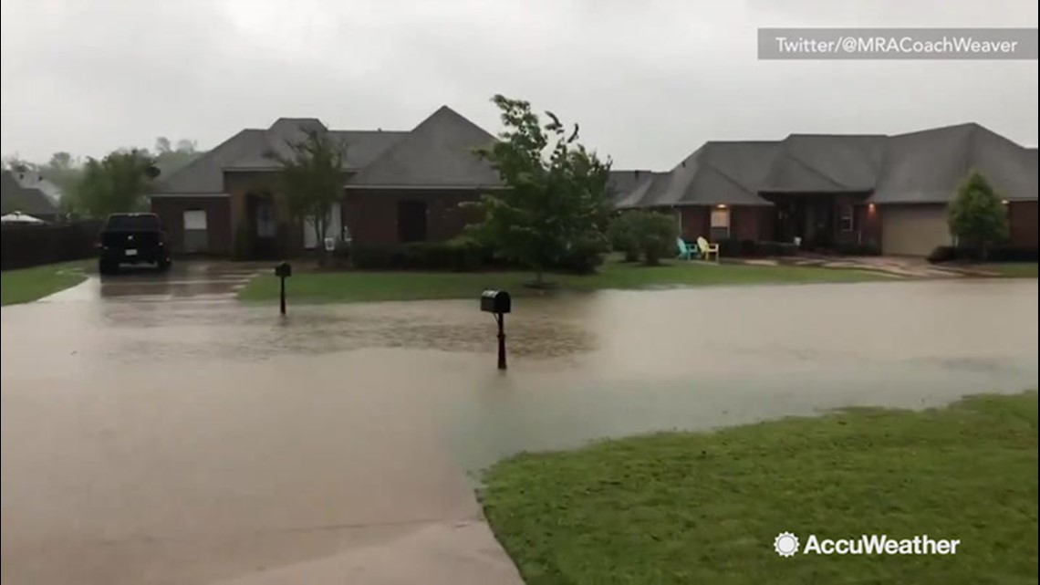 Homes and streets overwhelmed by flooding during severe storm ...