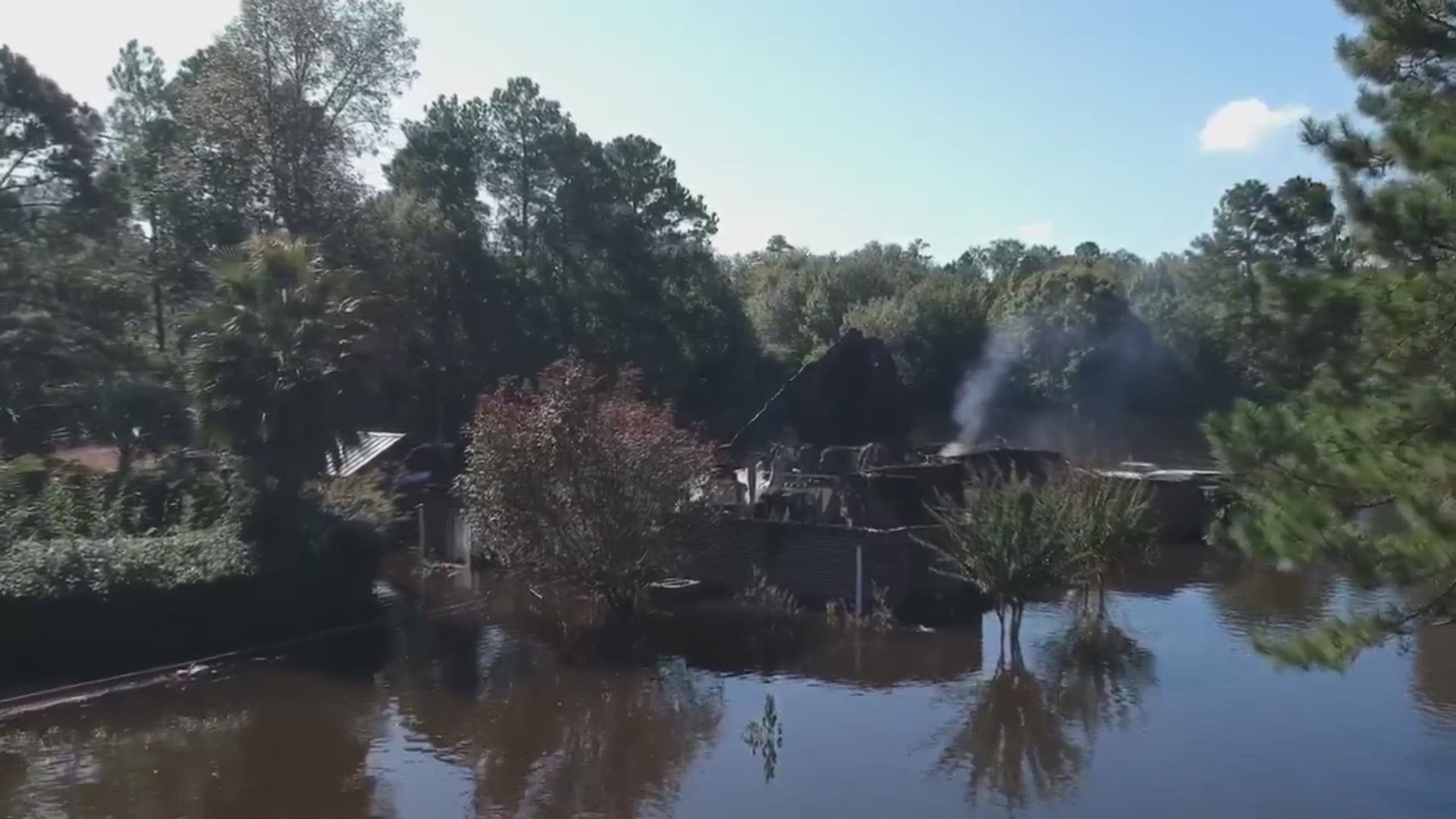 Drone video shows smoldering remains of Orange County home that burned ...