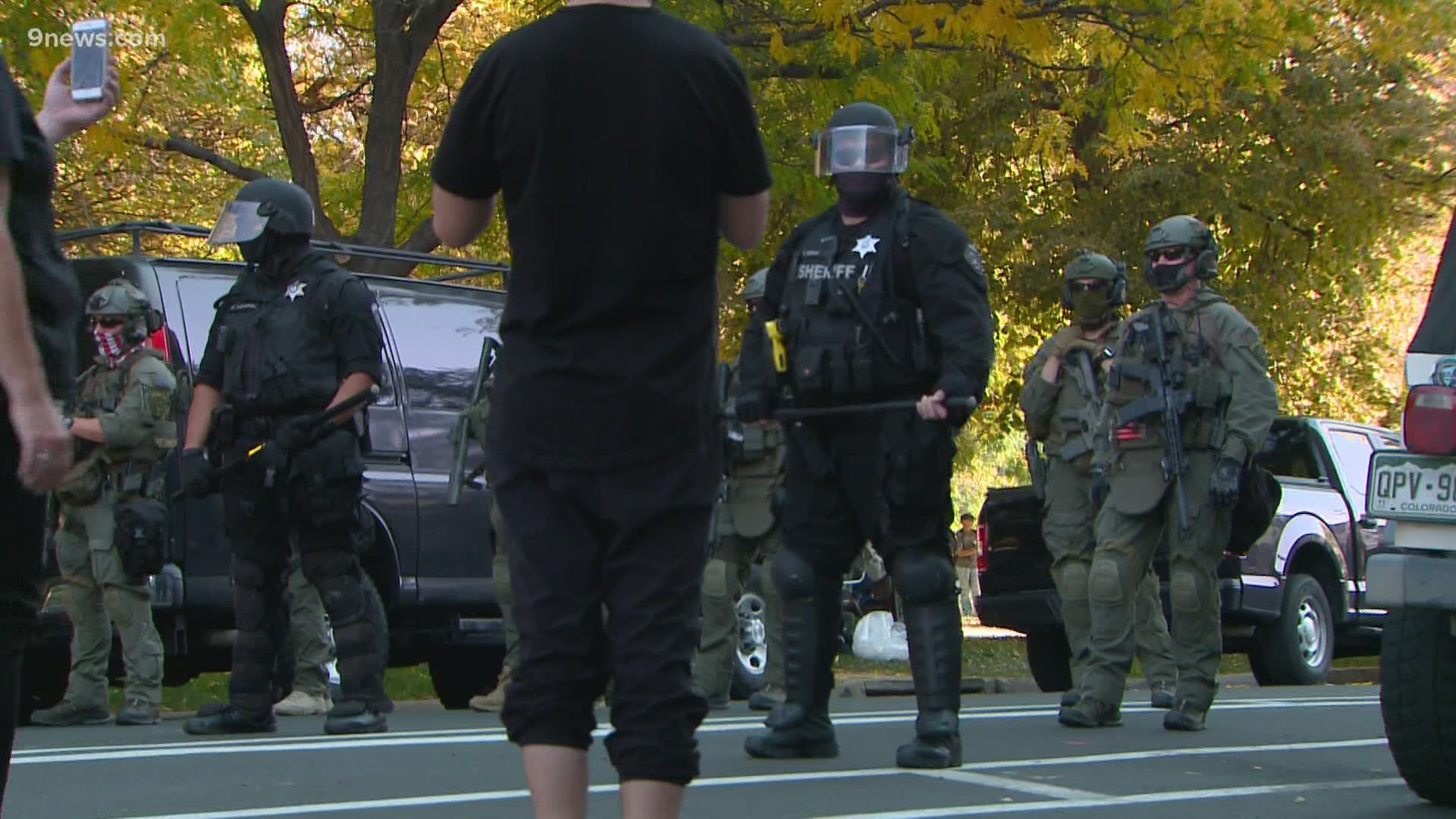 Officials: Security guard held in Denver shooting wasn’t licensed ...