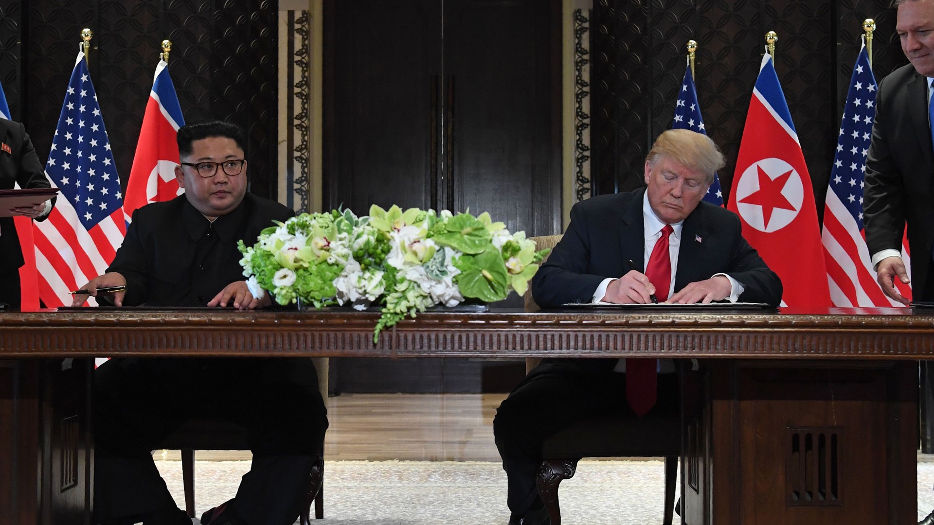 PHOTOS: President Trump and Kim Jong Un meet at historic summit ...